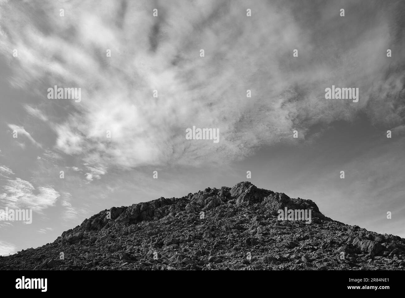 A scenic landscape featuring a mountain side with a clear blue sky ...