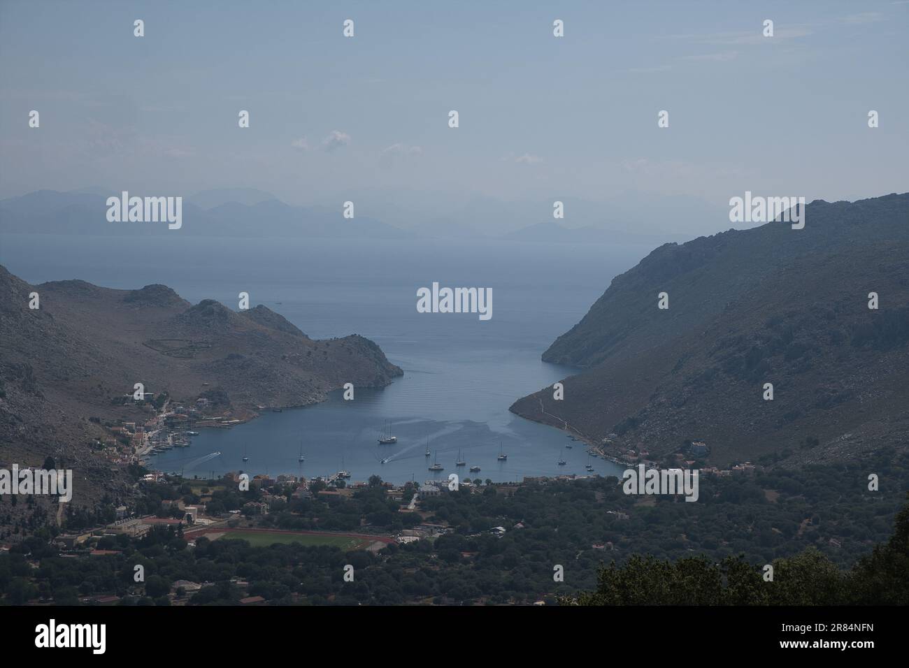 A scenic landscape featuring a mountain side with a clear blue sky ...