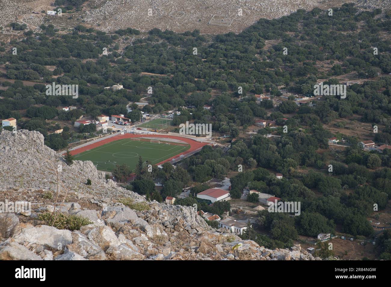 A scenic landscape featuring a mountain side with a clear blue sky ...