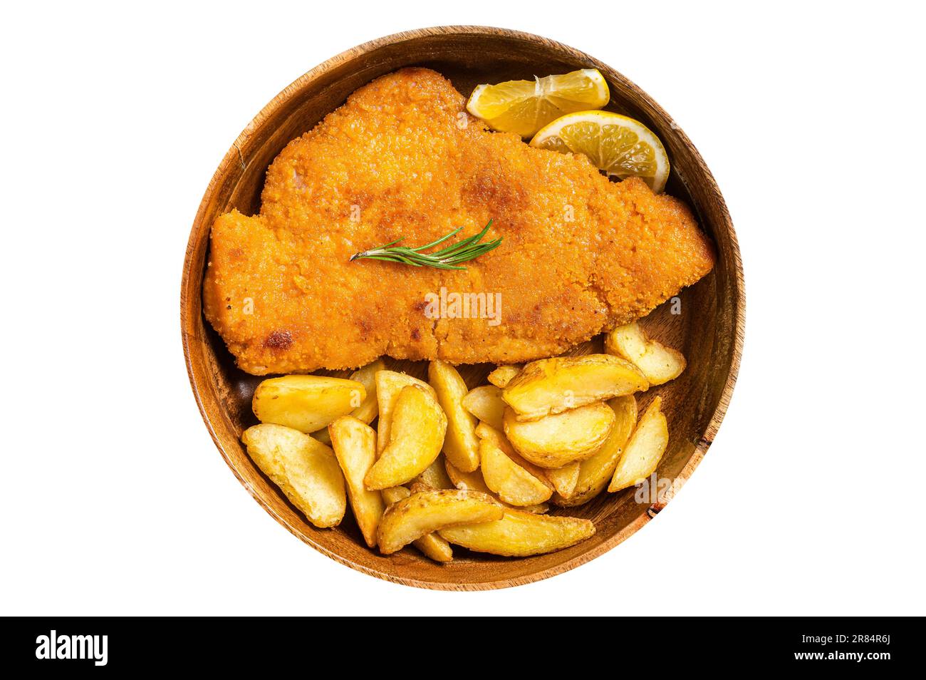 Austrian fried weiner schnitzel with potato wedges in a wooden plate ...