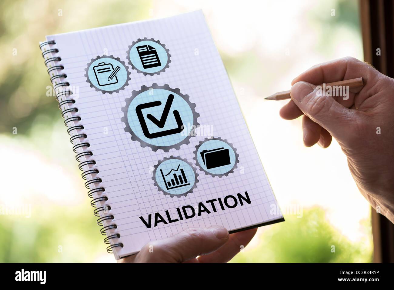 Hand drawing validation concept on a notepad Stock Photo - Alamy