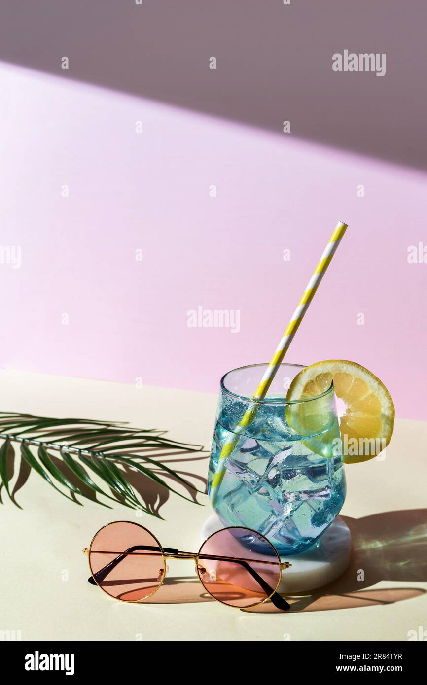 An image of a refreshing cocktail in a highball glass with lemon slices Stock Photo - Alamy