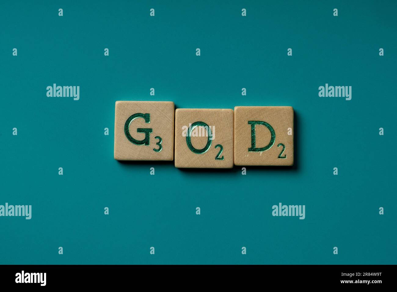 The wooden letters spelling the word God on a blue background Stock ...
