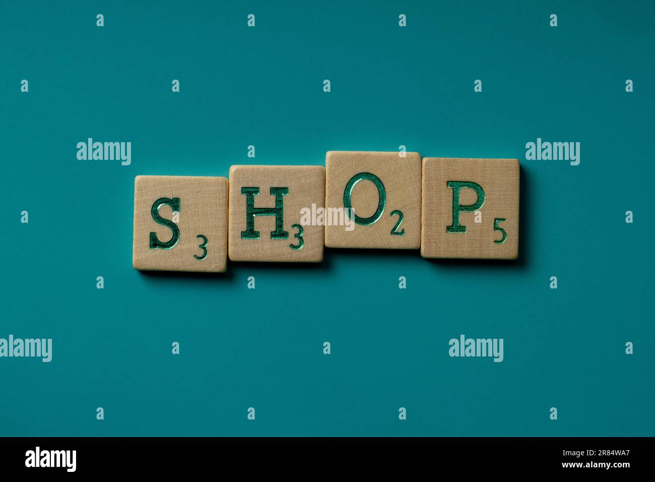 The wooden letters spelling the word shop on a blue background Stock ...