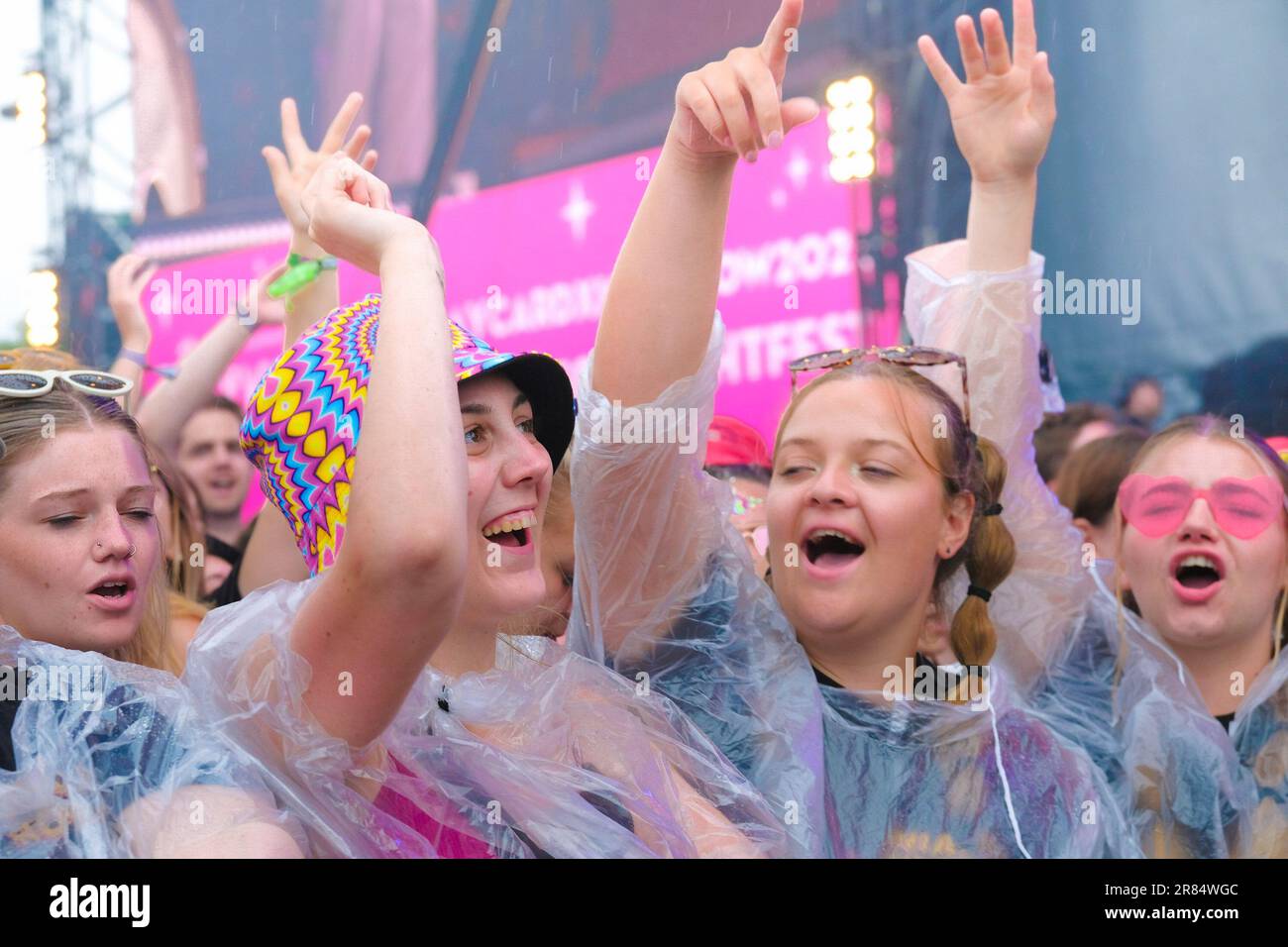 Crowd in rain seen watching MIKA live on the stage at the Isle of Wight ...