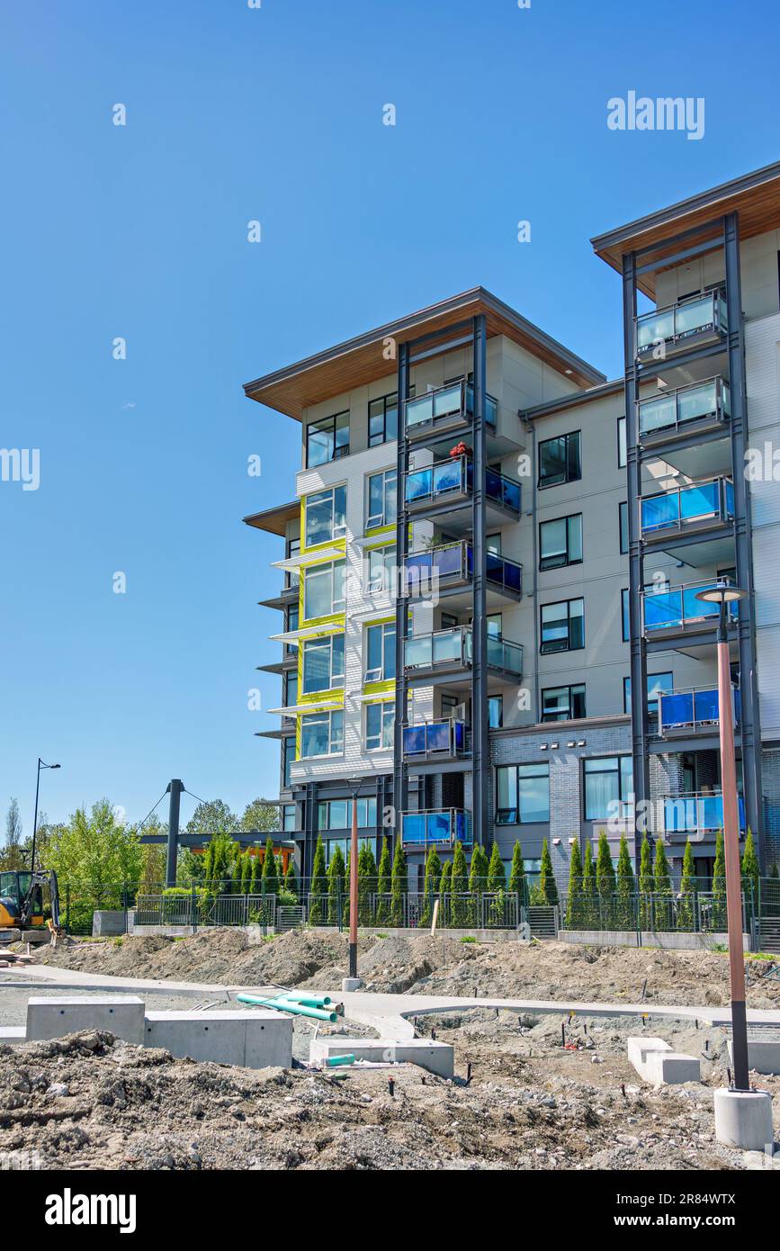 Low-rise residential building under construction on blue sky background ...