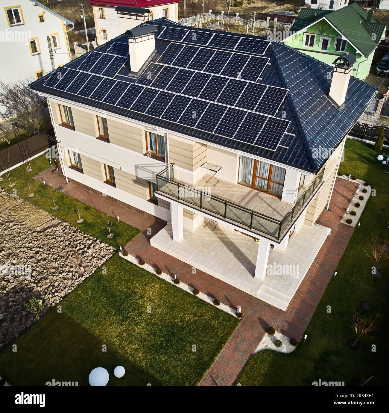 Modern two-storey house with solar panel modules for generating ...