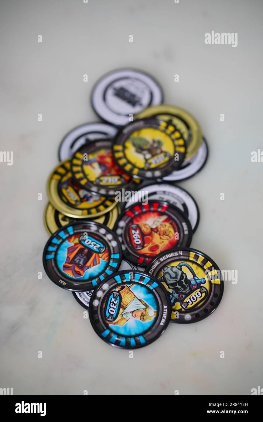 A stack of playing coins on a marble table Stock Photo - Alamy