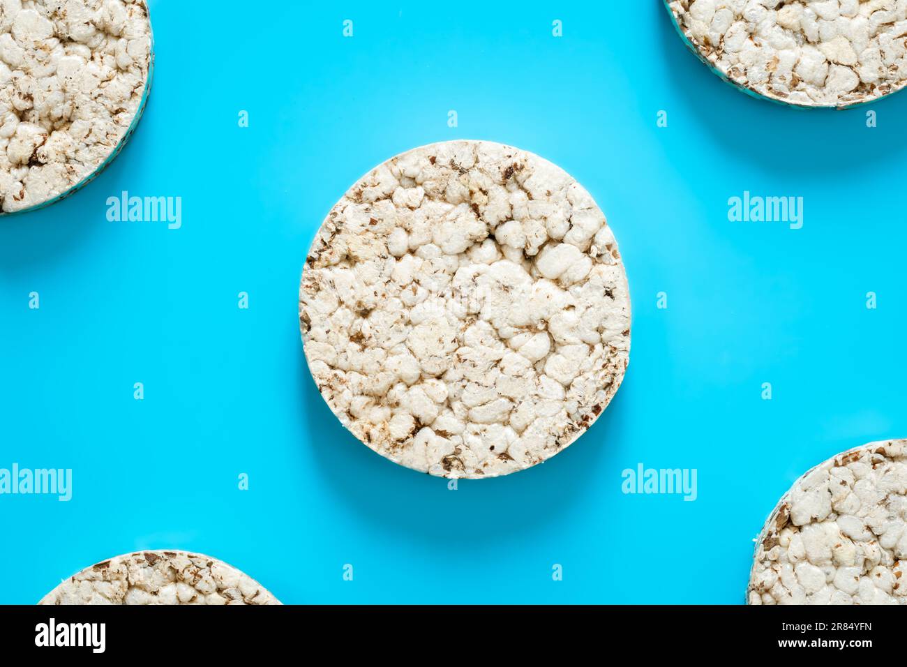 Puffed rice cakes on blue background, flat lay Stock Photo - Alamy