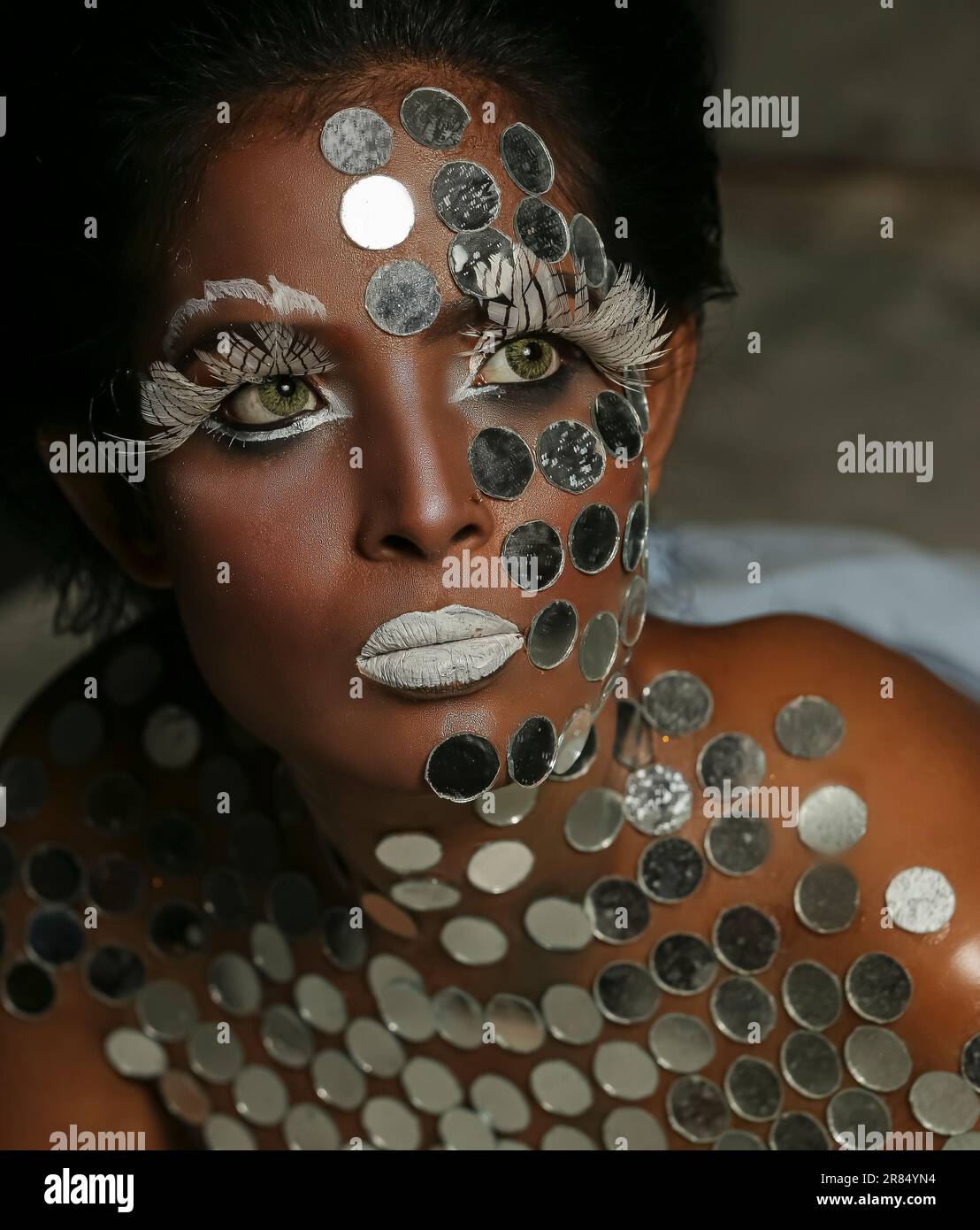 female face covered with pieces of glass Stock Photo - Alamy