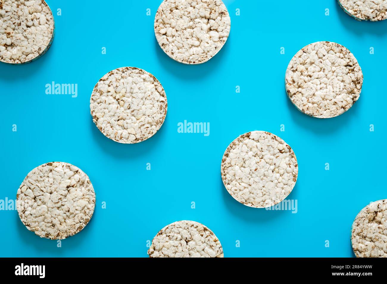 Puffed rice cakes on blue background, flat lay Stock Photo - Alamy