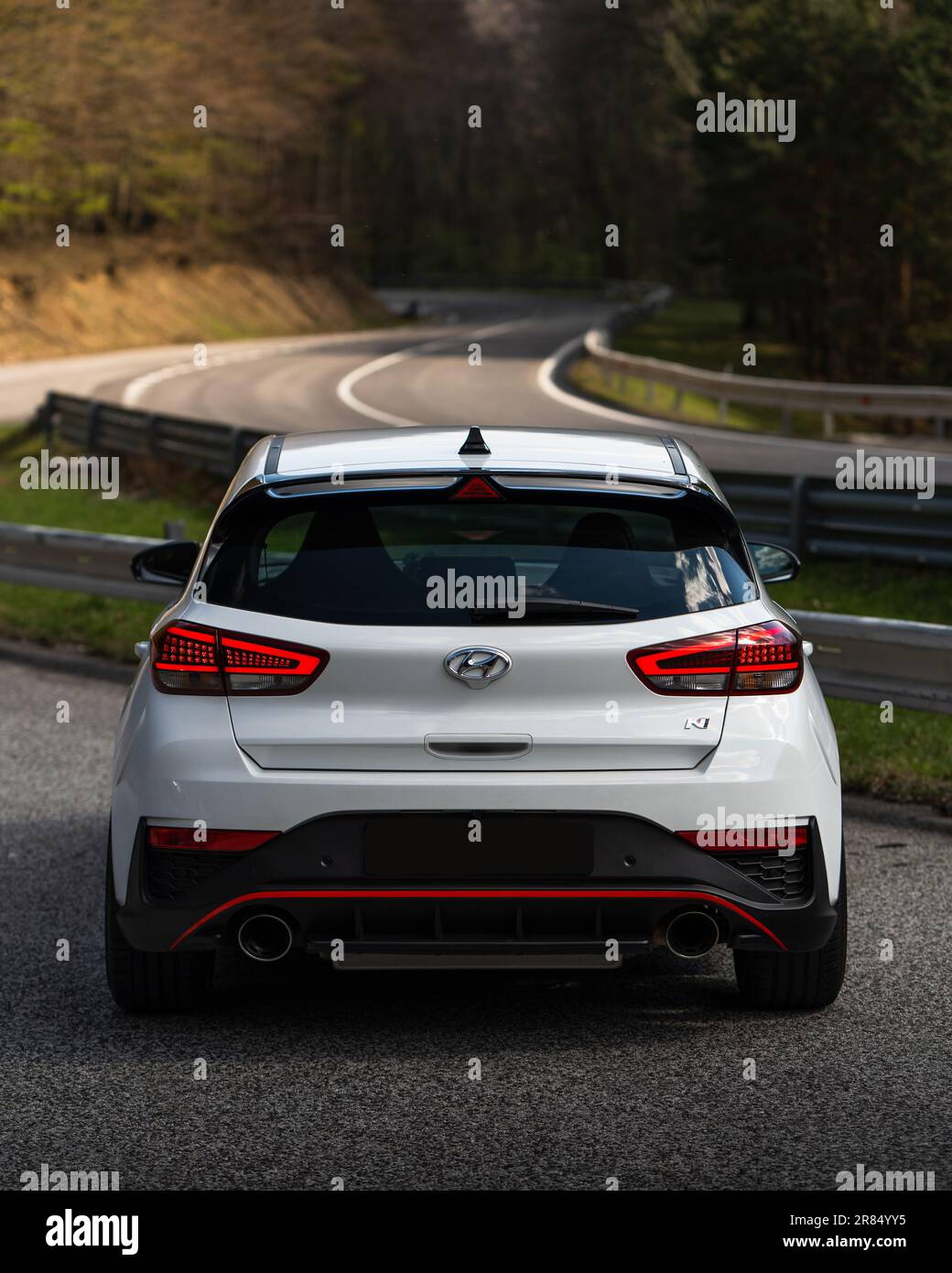 A rear view of a white 2020 Hyundai i30 on a winding road Stock Photo ...