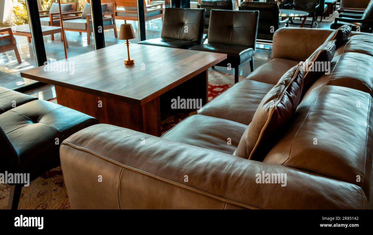 Leather sofa in the restaurant Stock Photo - Alamy