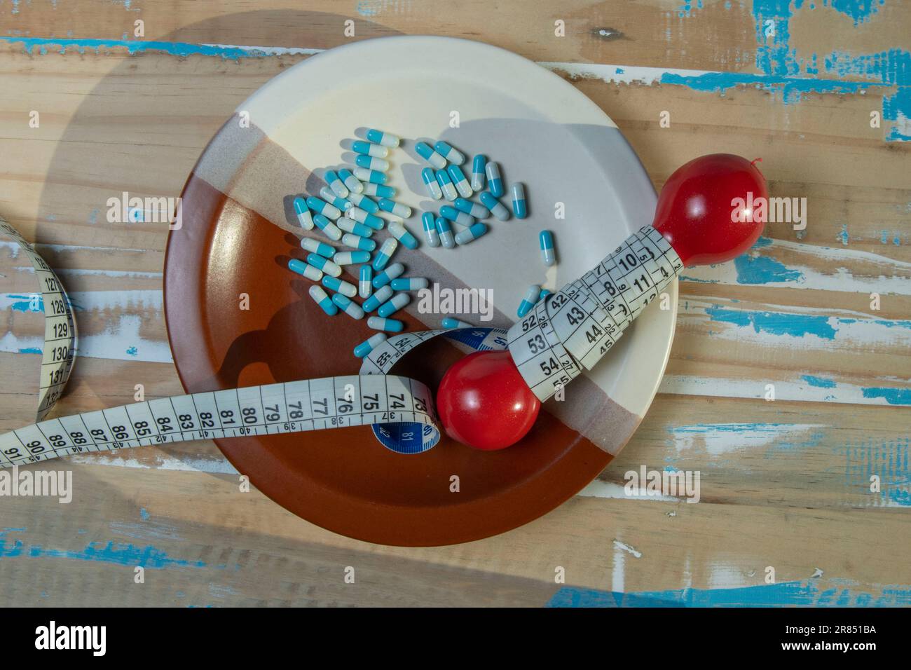 plate of food with an exercise weight inside symbolizing physical ...