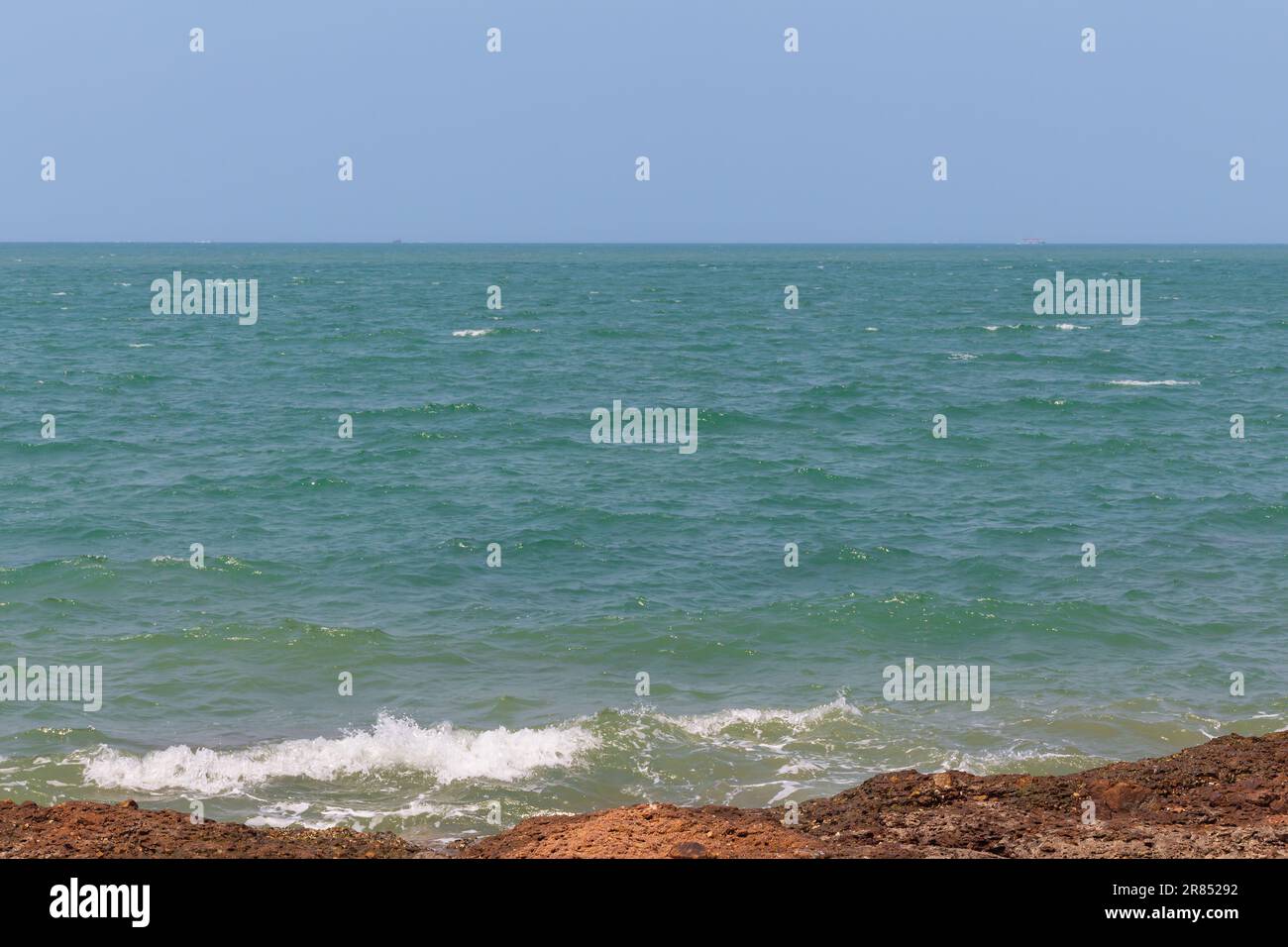 Atlantic ocean seascape.Ocean waves with rocks, blue sky. Calm ...