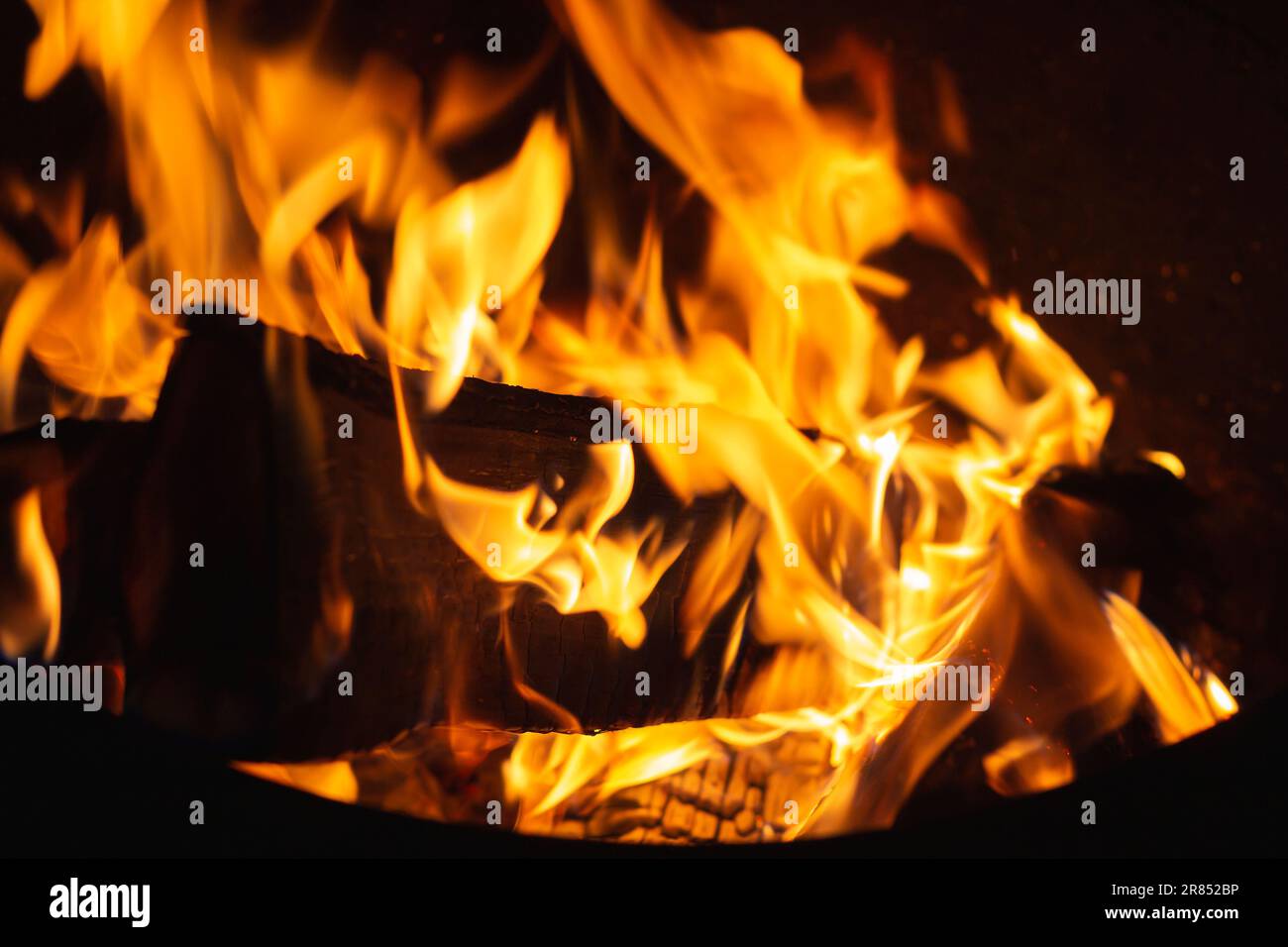 close-up flames in blur.Burning firewood in fireplace,vivid burning ...