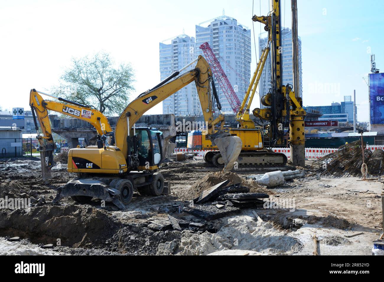 construction site, excavators JCB digging, machines working. Demolition ...
