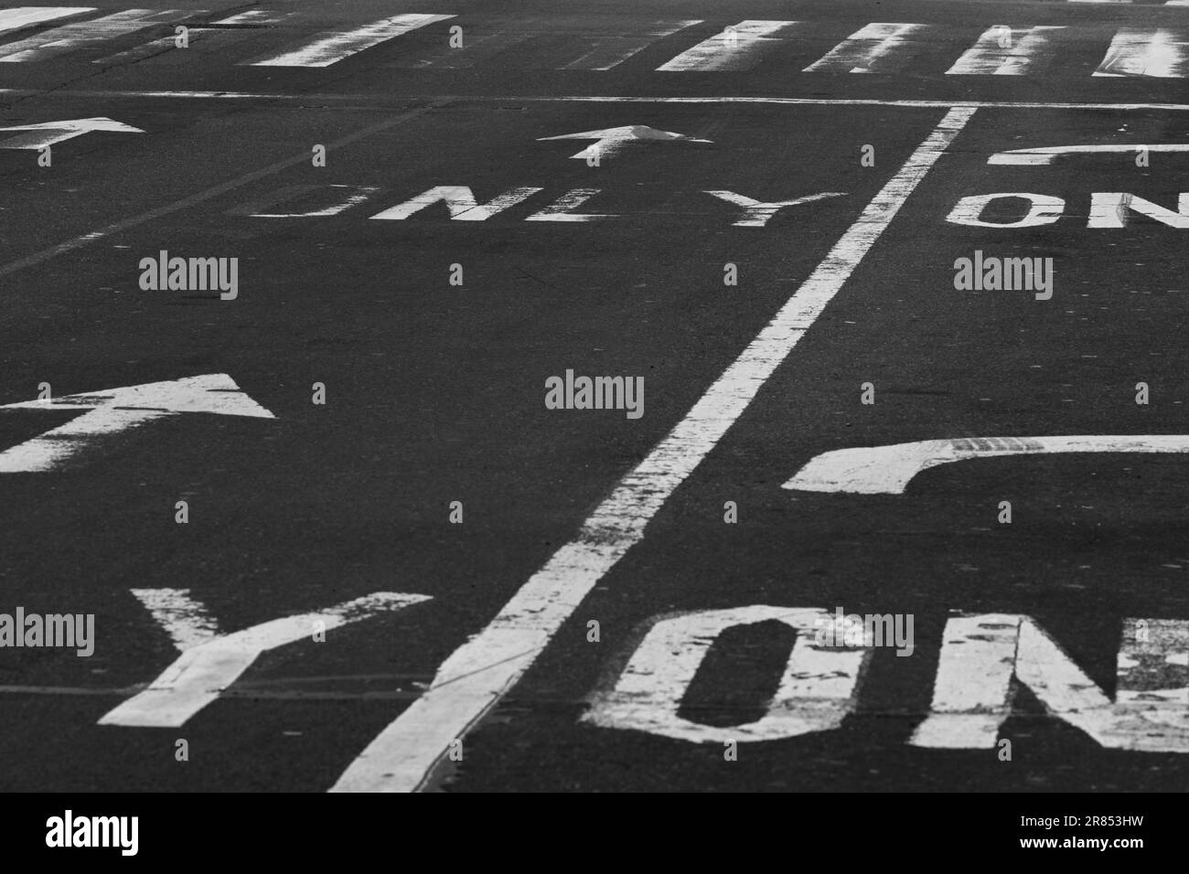A closeup of traffic signs on asphalt in New York City, USA Stock Photo ...