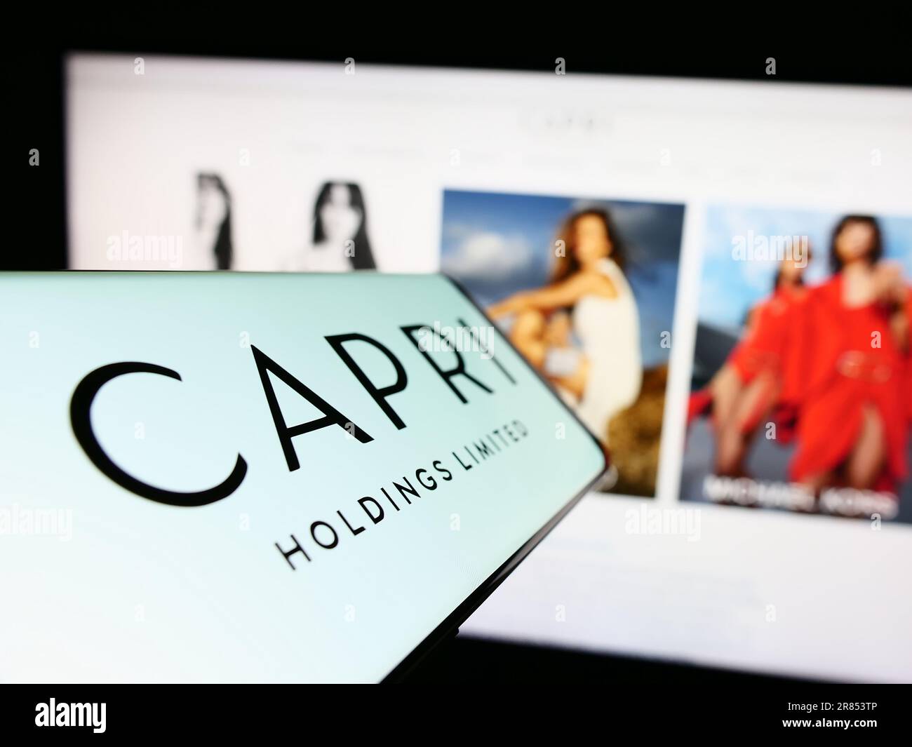 Mobile phone with logo of fashion company Capri Holdings Limited on ...