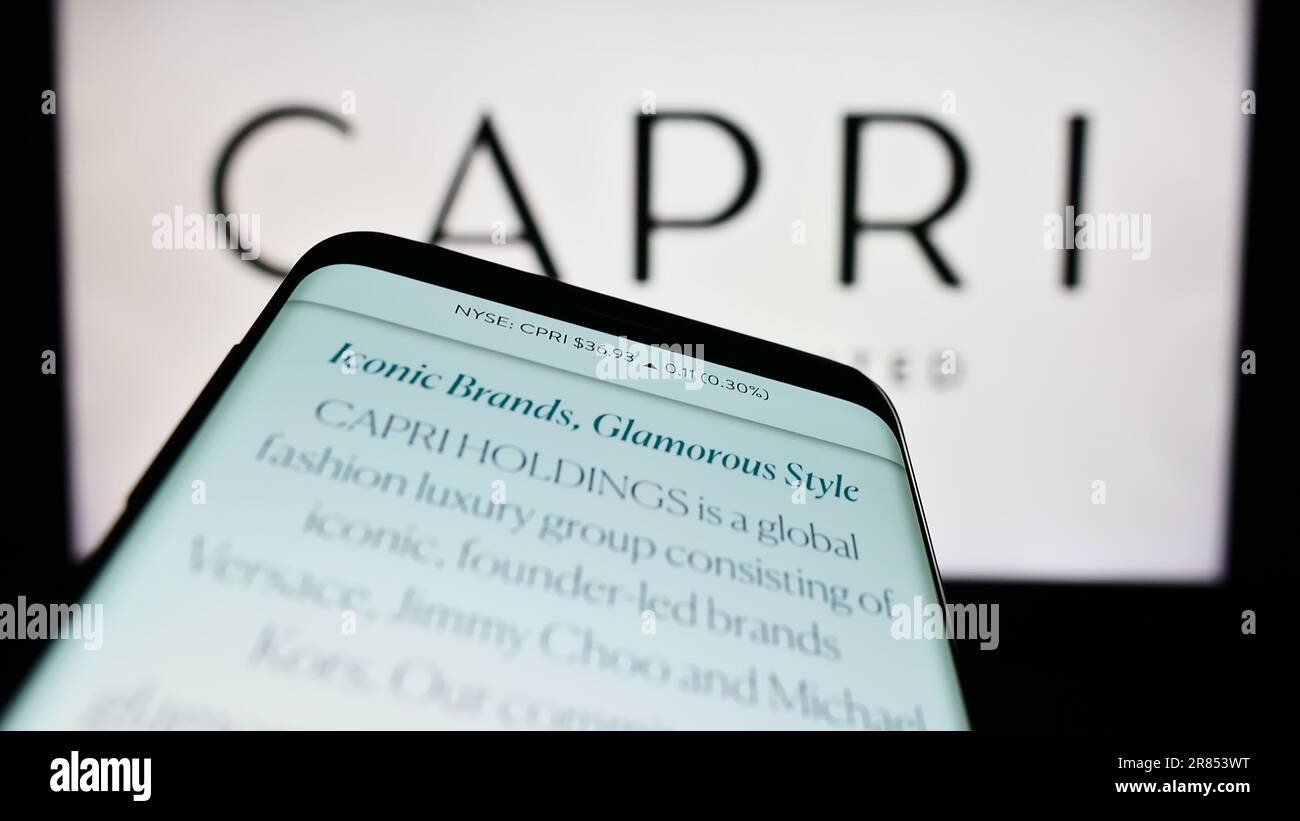 Smartphone with webpage of fashion company Capri Holdings Limited on ...