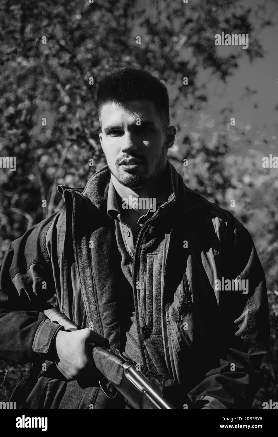 Hunter with shotgun gun on hunt. Close up Portrait of hamdsome Hunter ...