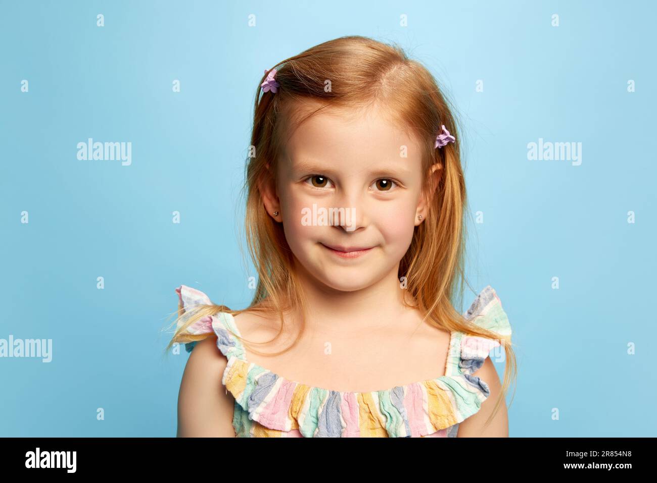 Close-up portrait of pretty little girl, redhead child with cute ...