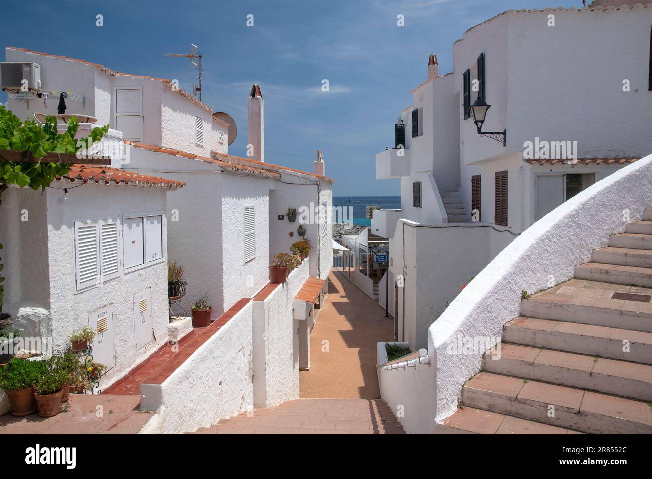Streets and white walls of touristic fishing village of Binibeca Nou in ...