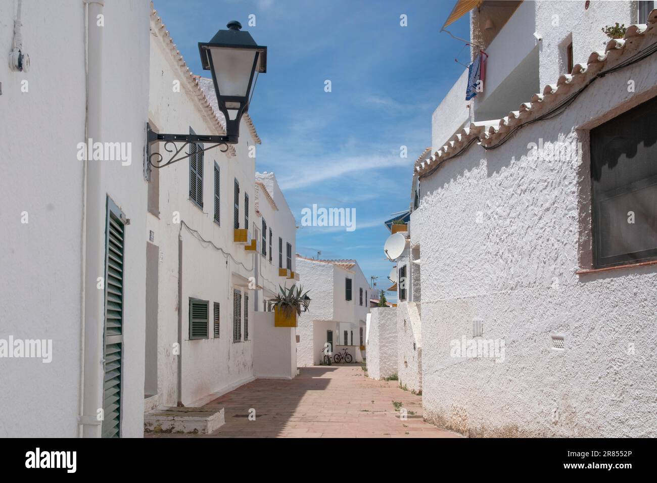 Streets and white walls of touristic fishing village of Binibeca Nou in ...