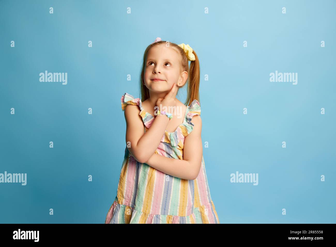 Portrait of cute, beautiful little girl, child standing with calm ...