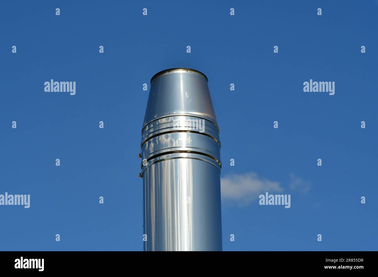 fire place chimmney modern pipe steel wood fire clean Stock Photo - Alamy