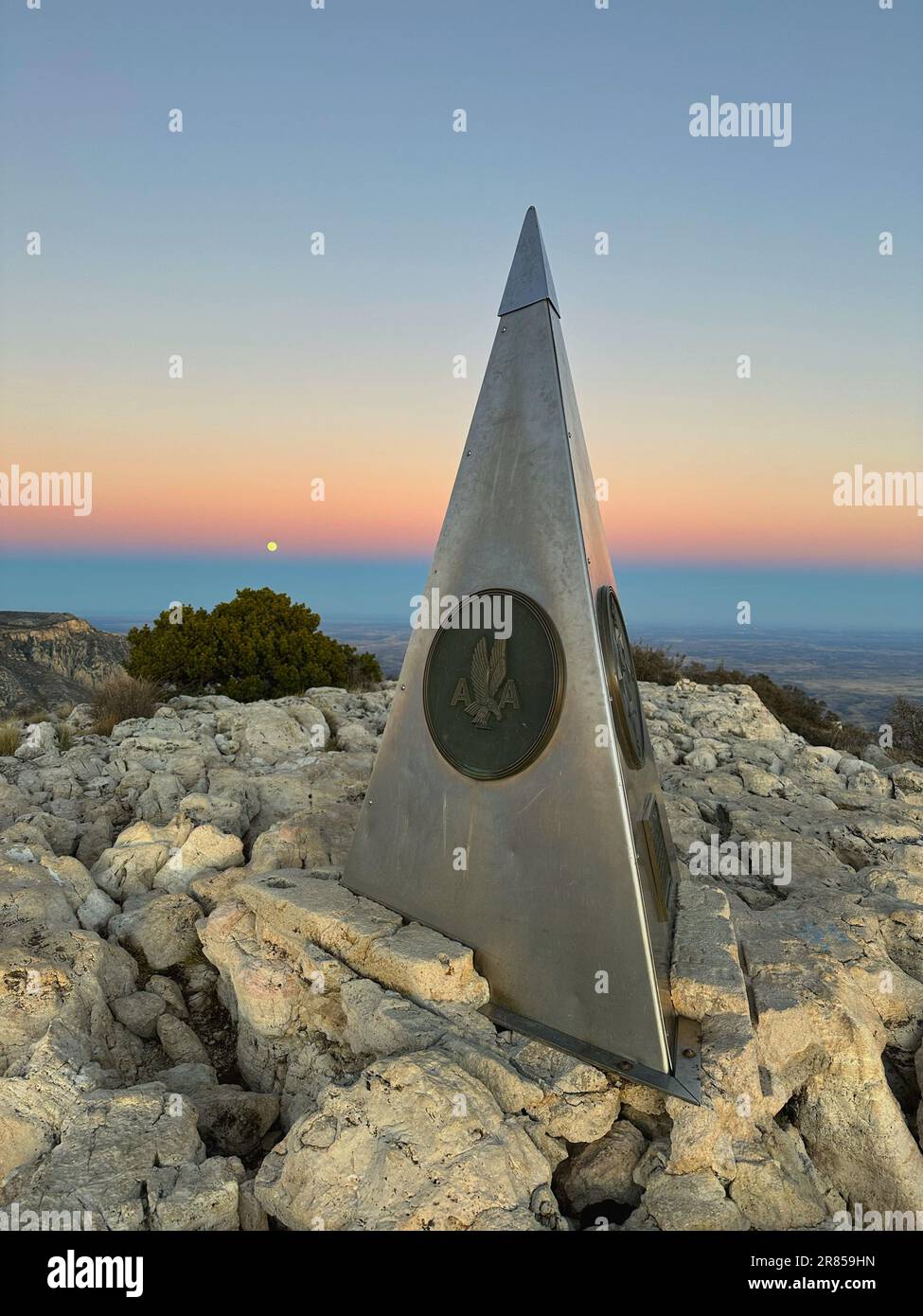 A triangular-shaped stone monument in beach Stock Photo - Alamy