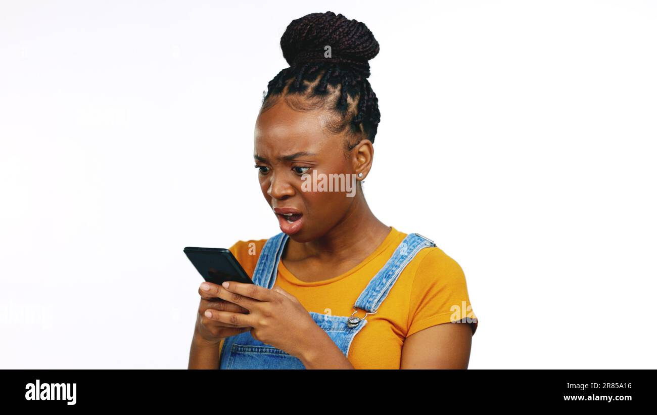 Phone, bad news and anger with a black woman in studio isolated on a ...