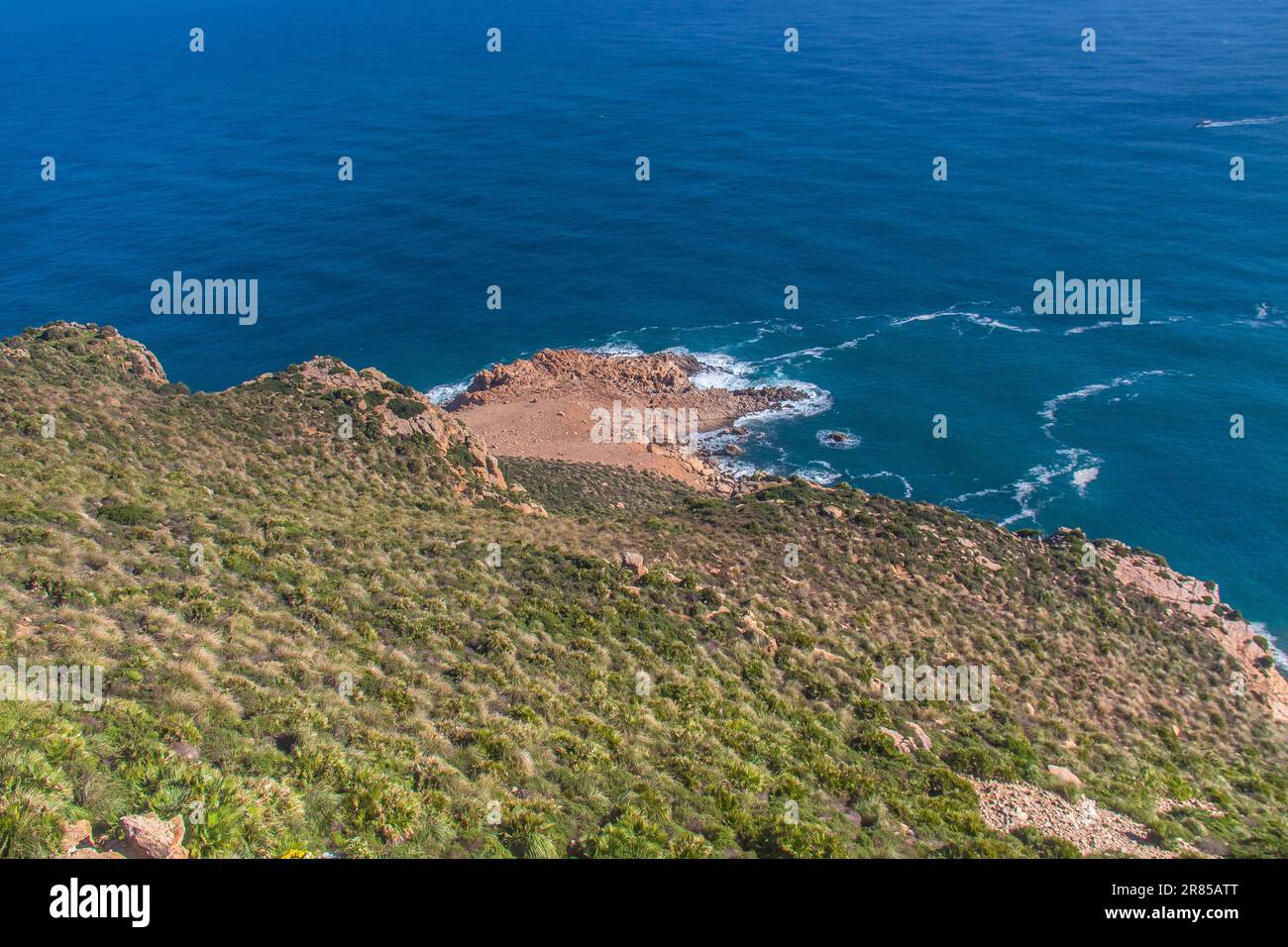 Beach and Mountains under a Blue Sky at Crique Mteris, Haouaria ...