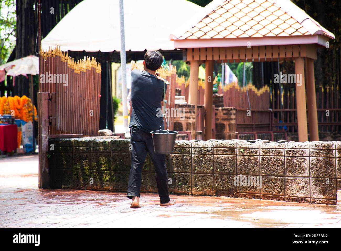 Thai people carry water for make a votive offering redeem a vow to ...