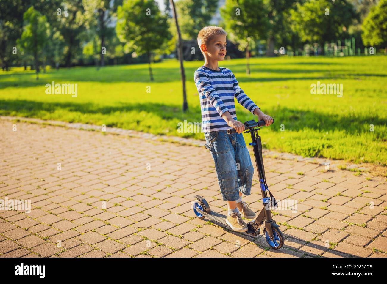 Cycling boy park hi-res stock photography and images - Alamy