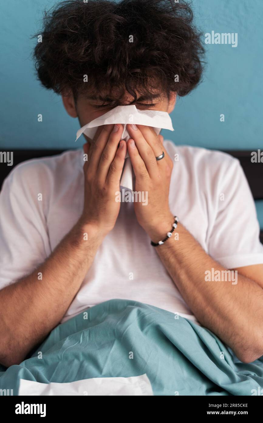 Cold and flu concept. Sick man suffering from running stuffy nose ...