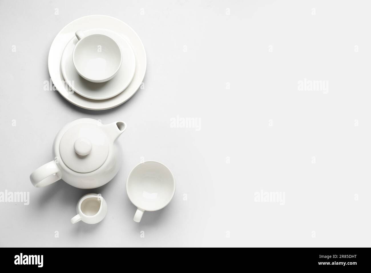 Stylish tea set on grey background Stock Photo - Alamy