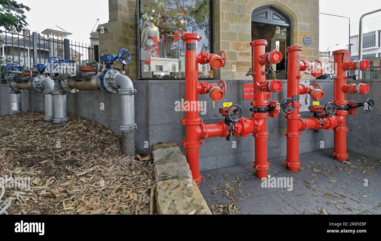 702 Red-painted components of a fire brigade booster point at 265 ...