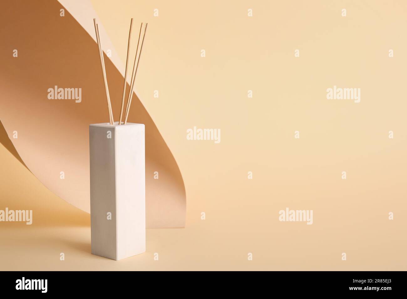 Reed diffuser on beige background Stock Photo - Alamy