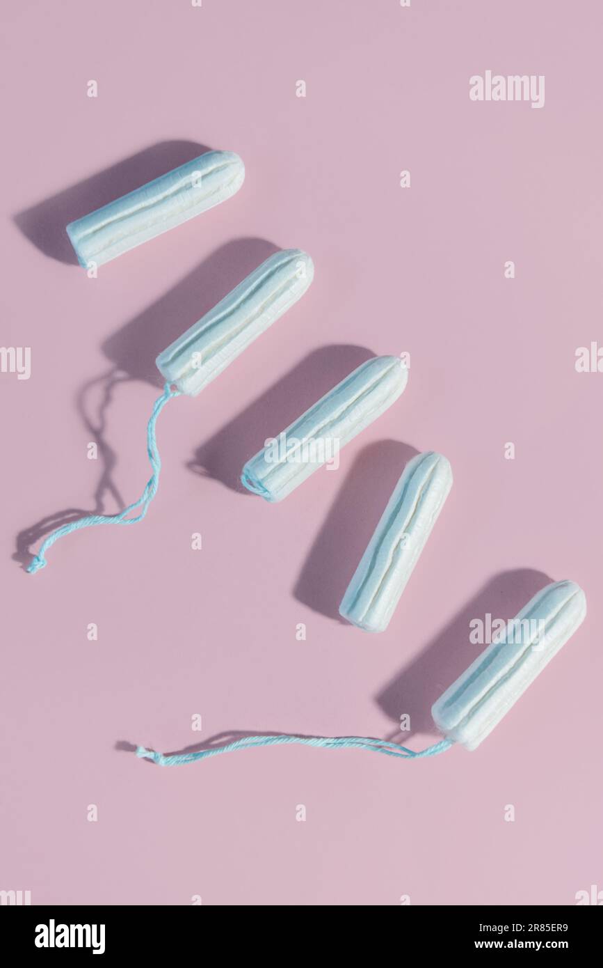 Menstrual tampons on lilac background Stock Photo - Alamy