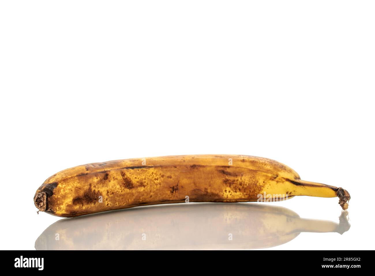 One overripe banana, macro, isolated on white background Stock Photo ...