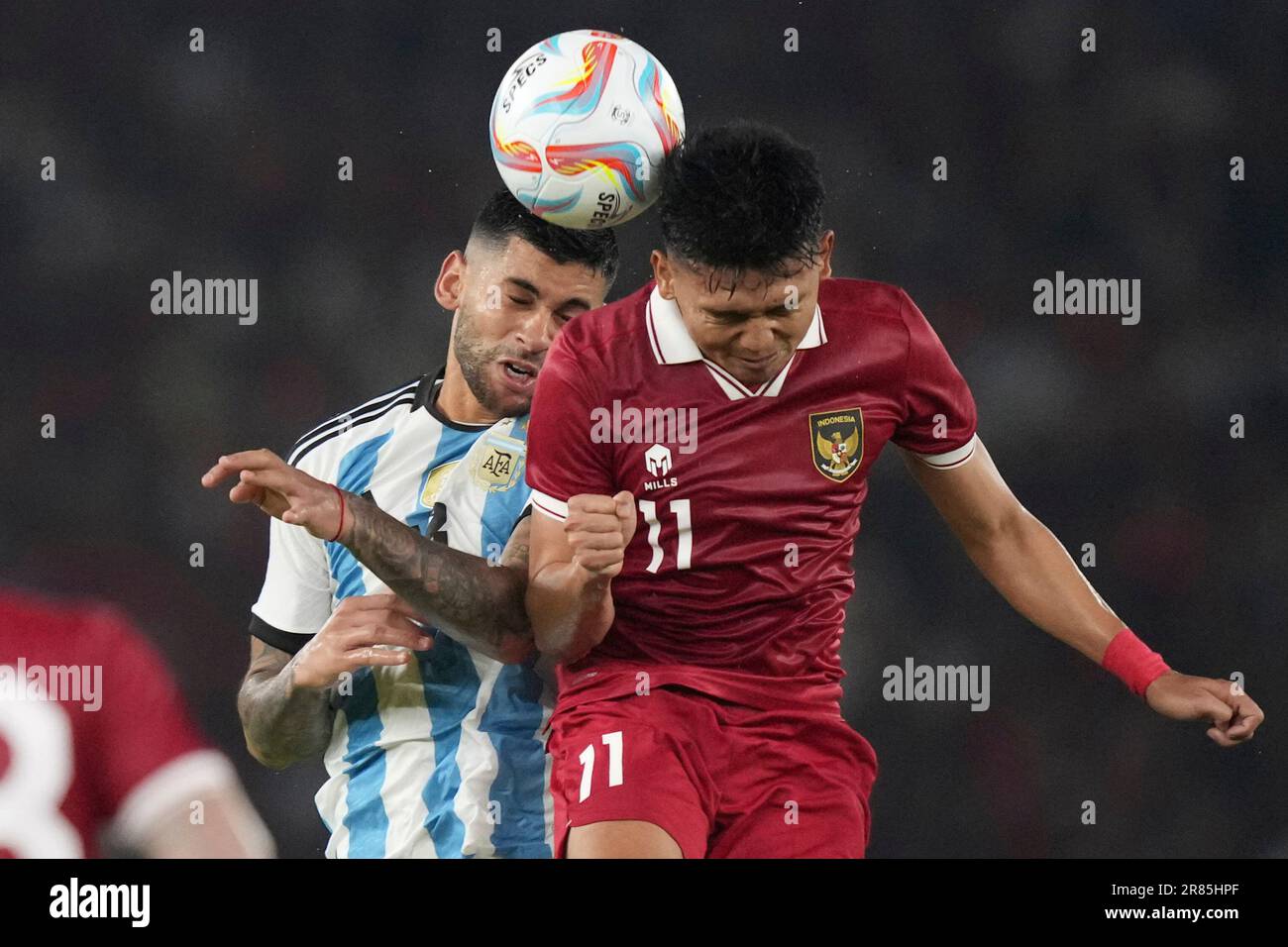 Argentina's Cristian Romero, left, battles for the ball against ...