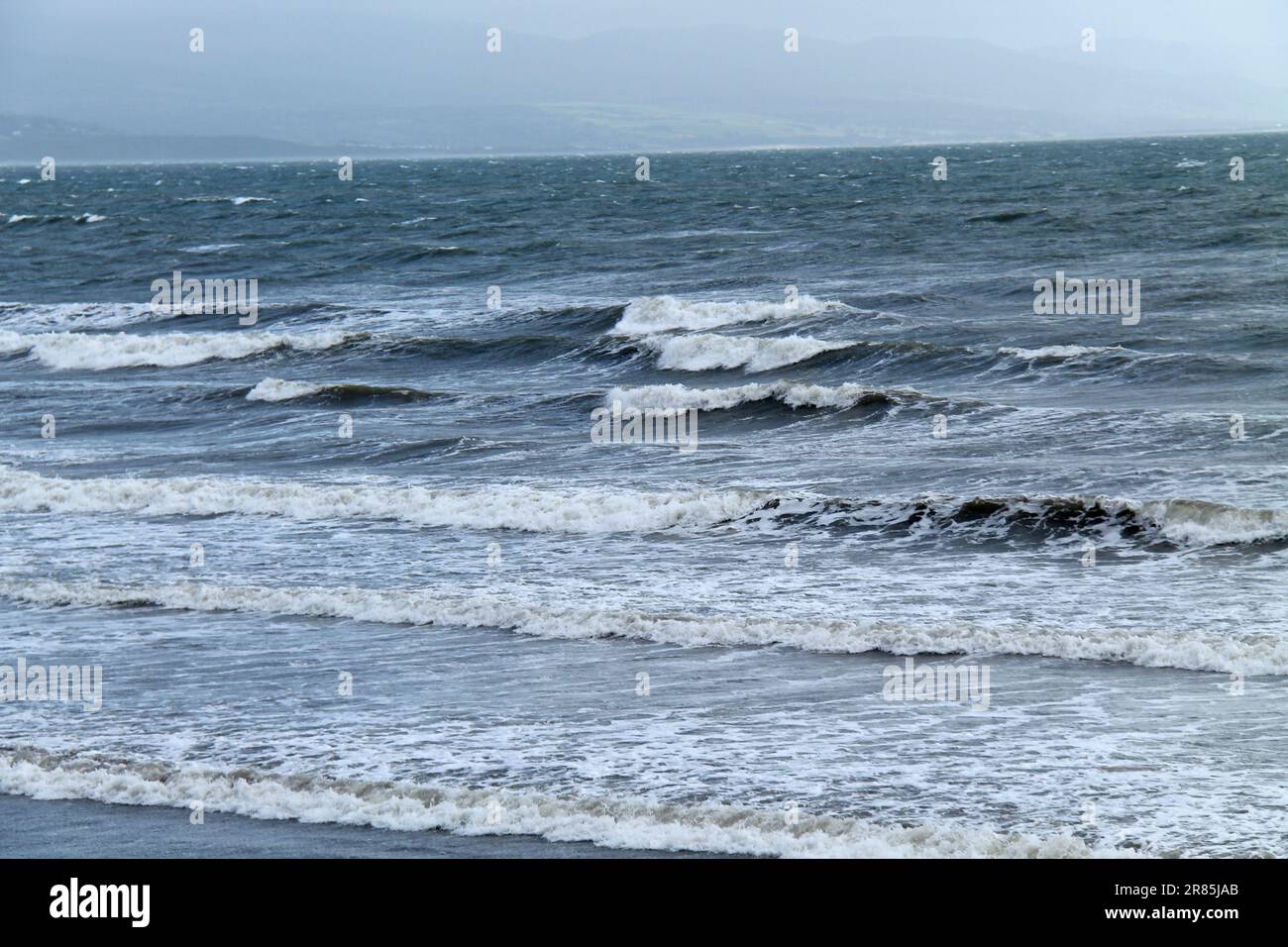 Sea Waves Breaking on a Shallow Coastal Beach Stock Photo - Alamy