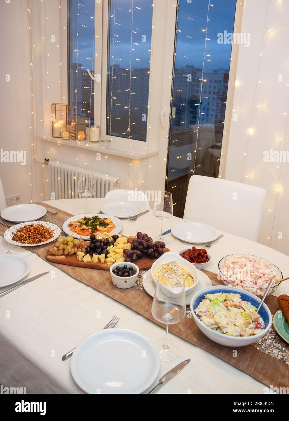 Festive celebration table decorated with white and golden tablecloth ...