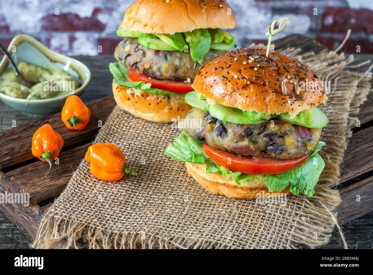 Plantain and black bean burger in brioche bun Stock Photo - Alamy