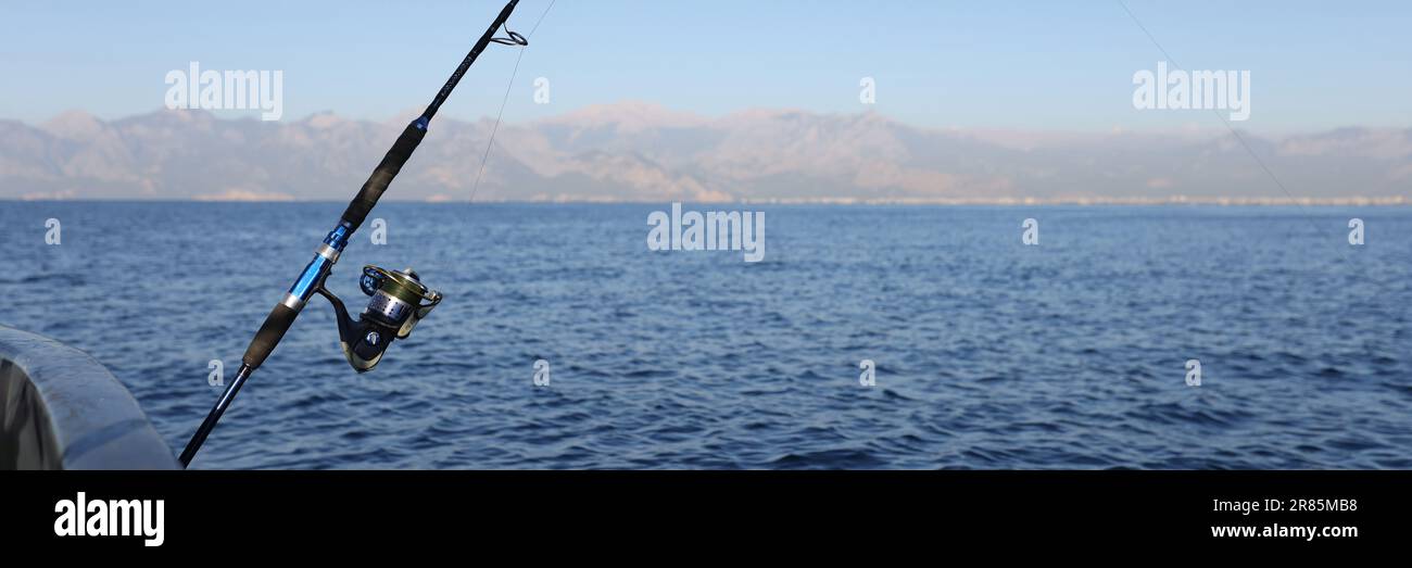 Sea fishing from steel fishing boat on open water Stock Photo - Alamy