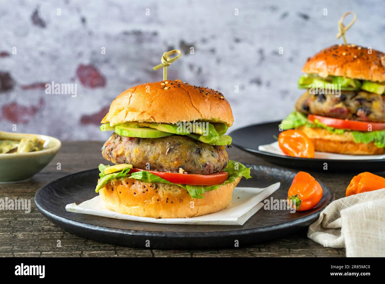 Plantain and black bean burger in brioche bun Stock Photo - Alamy