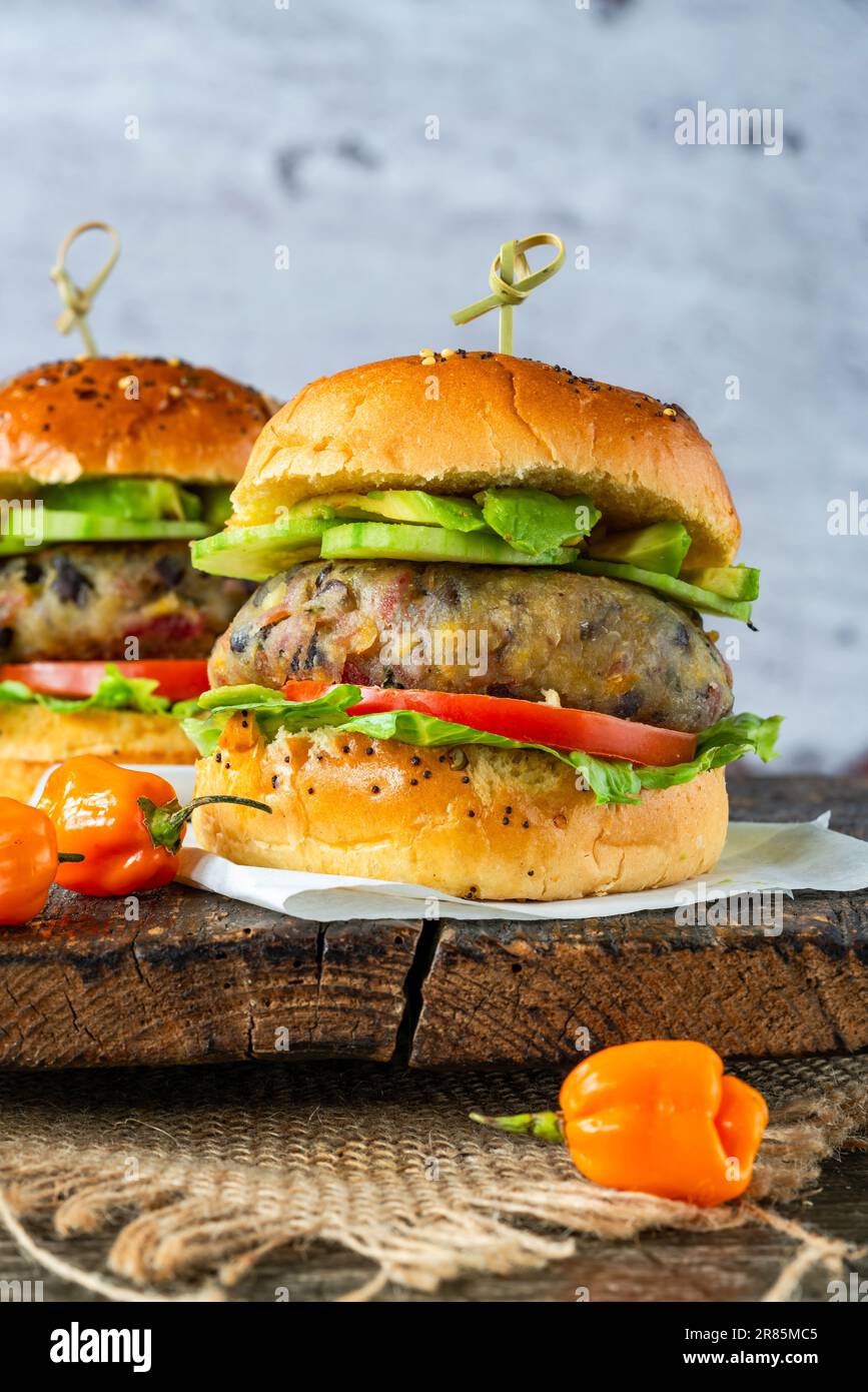 Plantain and black bean burger in brioche bun Stock Photo - Alamy