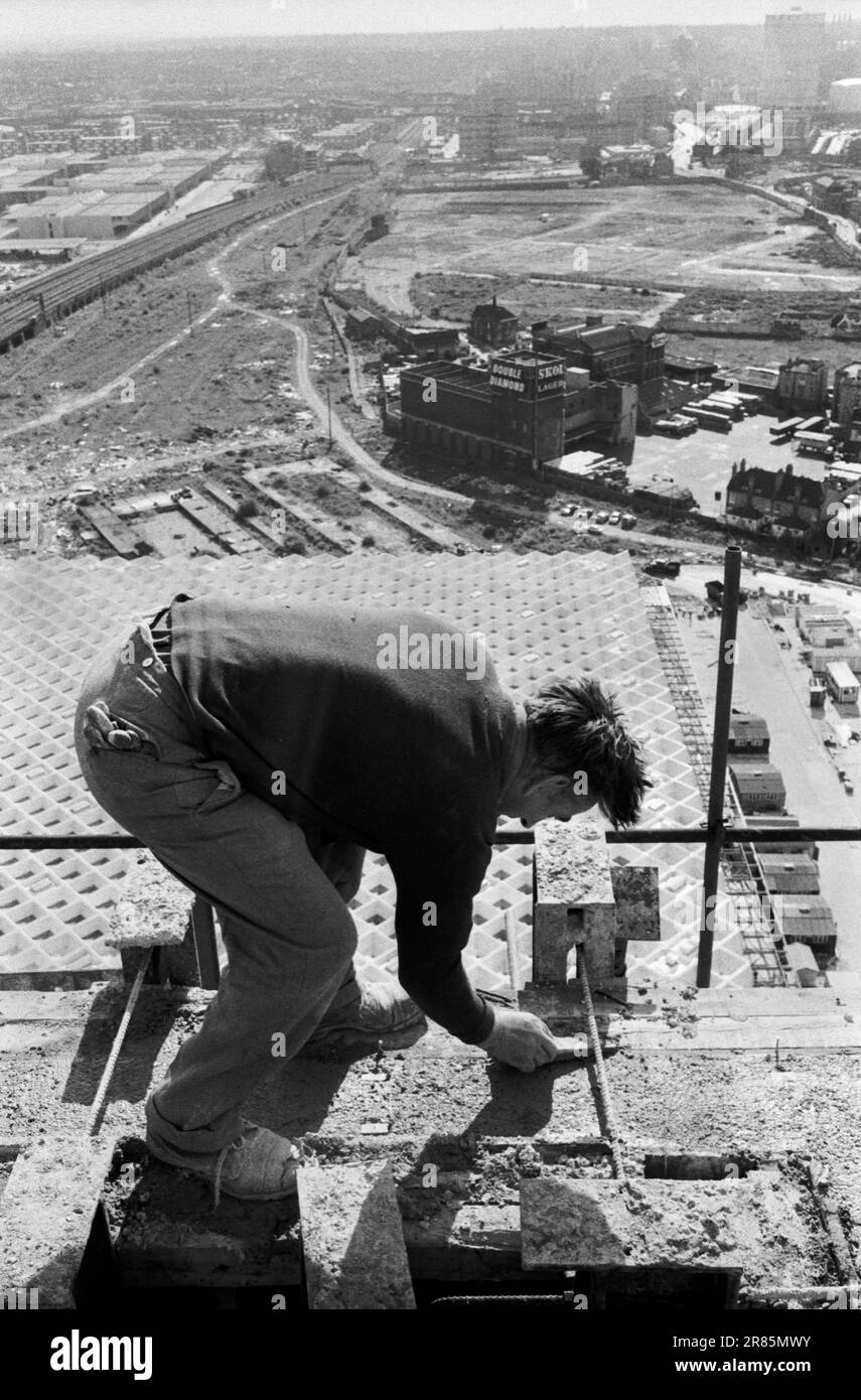 London cityscape view 1970s. An Irish navvie navvy, a construction ...
