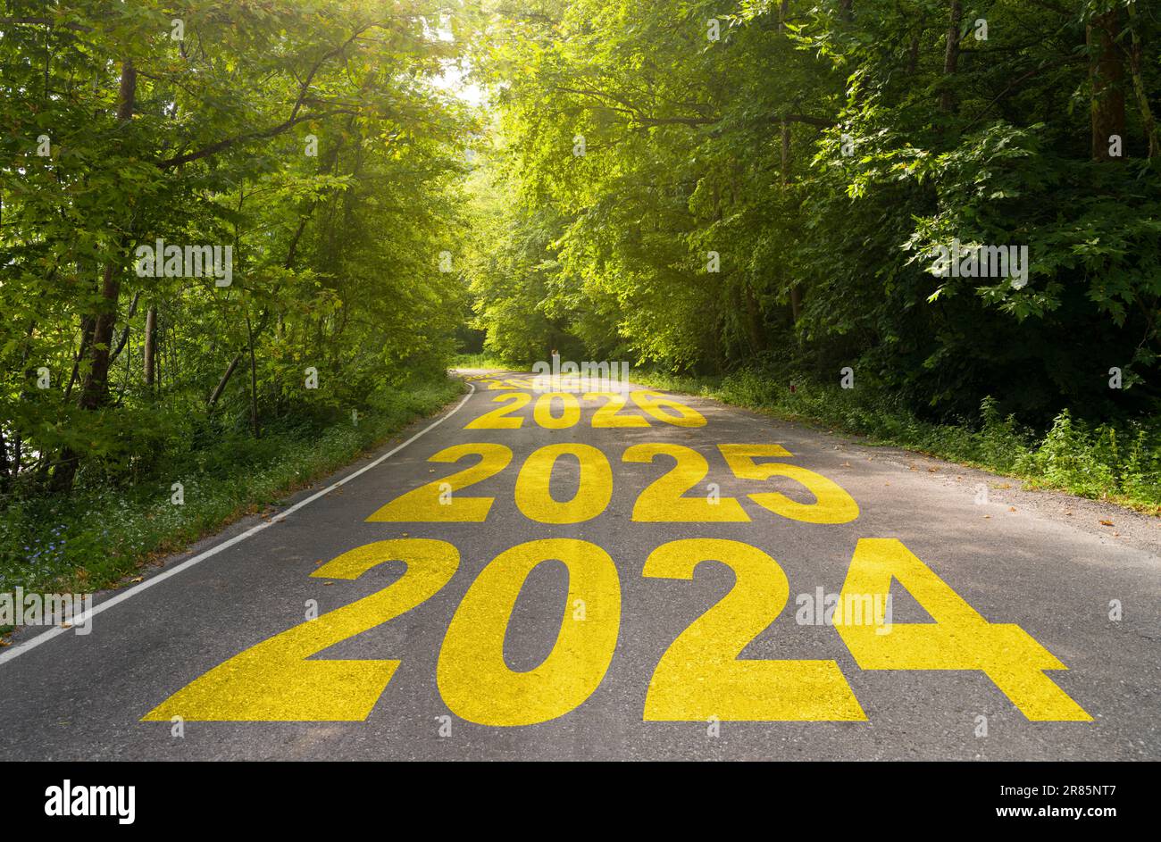 2024-2036 written on highway road in the middle of empty curvy asphalt ... 2024-2036 written on highway road in the middle of empty curvy asphalt ...